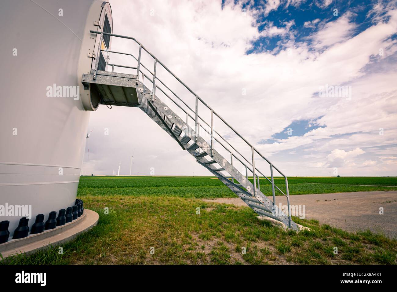 Side view of entrance, doorway with stairs into large wind power ...