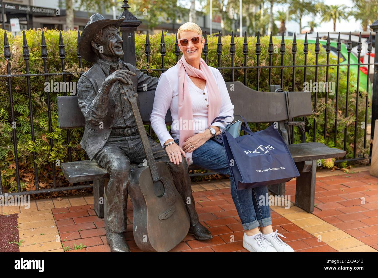 Tamworth city centre, model released lady poses beside bronze statue of ...