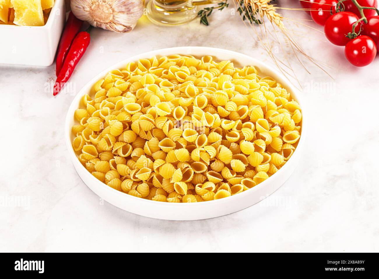 Italian cuisine - dry conchiglie shell pasta Stock Photo - Alamy