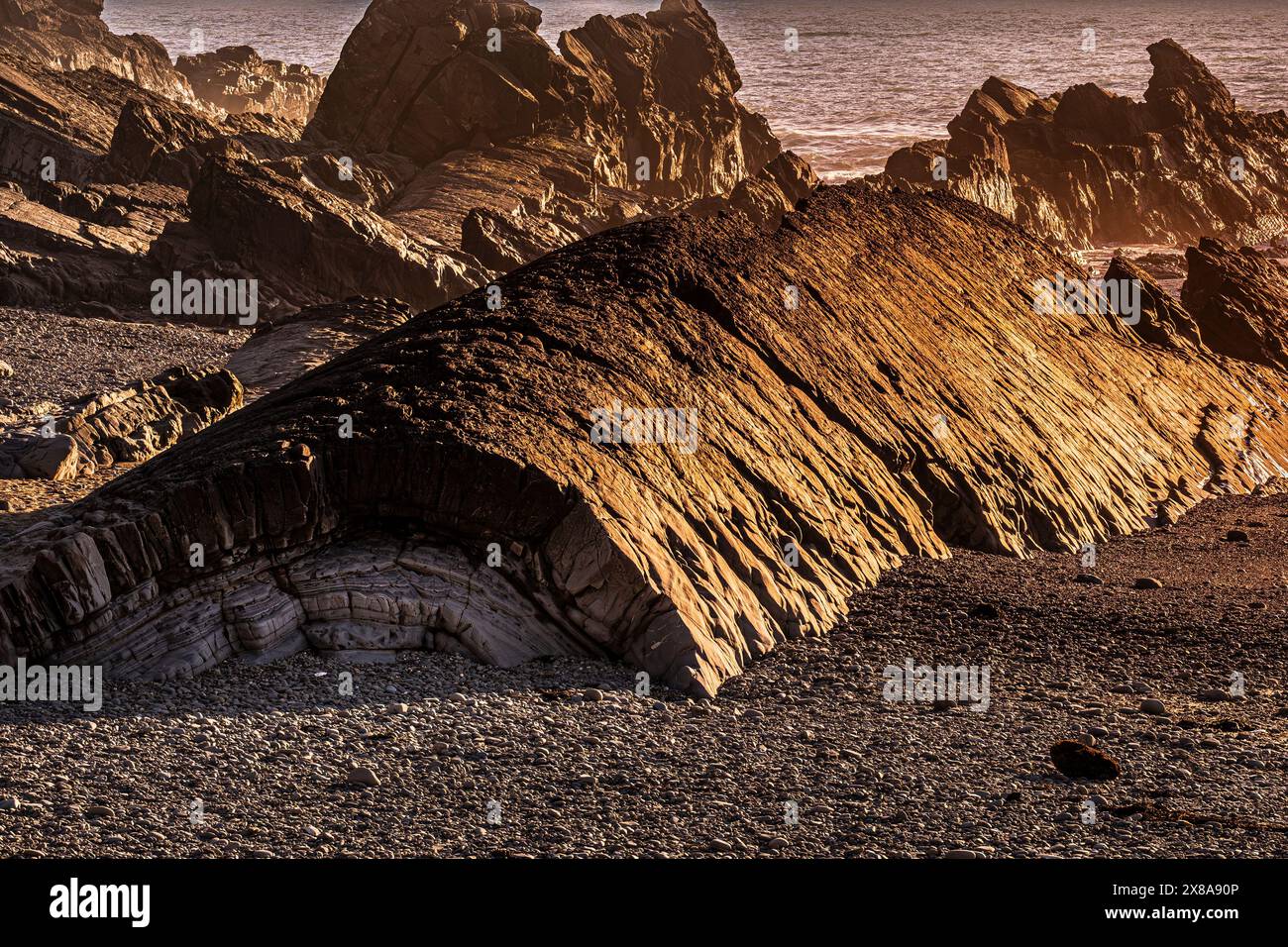 Evening light over the iconic geological formation known as Whale Rock ...