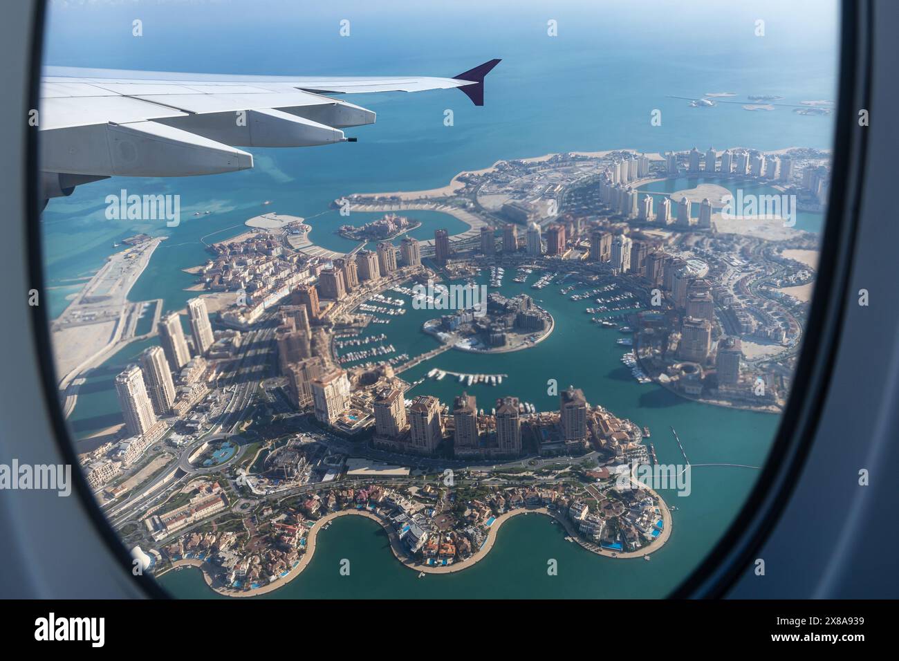 The doha skyline from the window of an airplane Stock Photo - Alamy