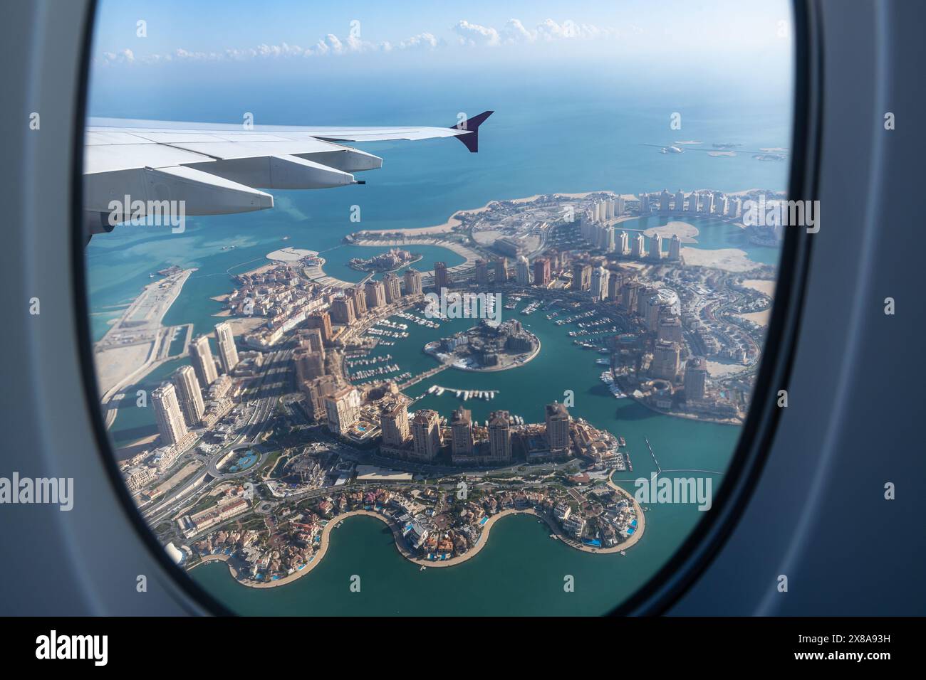 The doha skyline from the window of an airplane Stock Photo - Alamy
