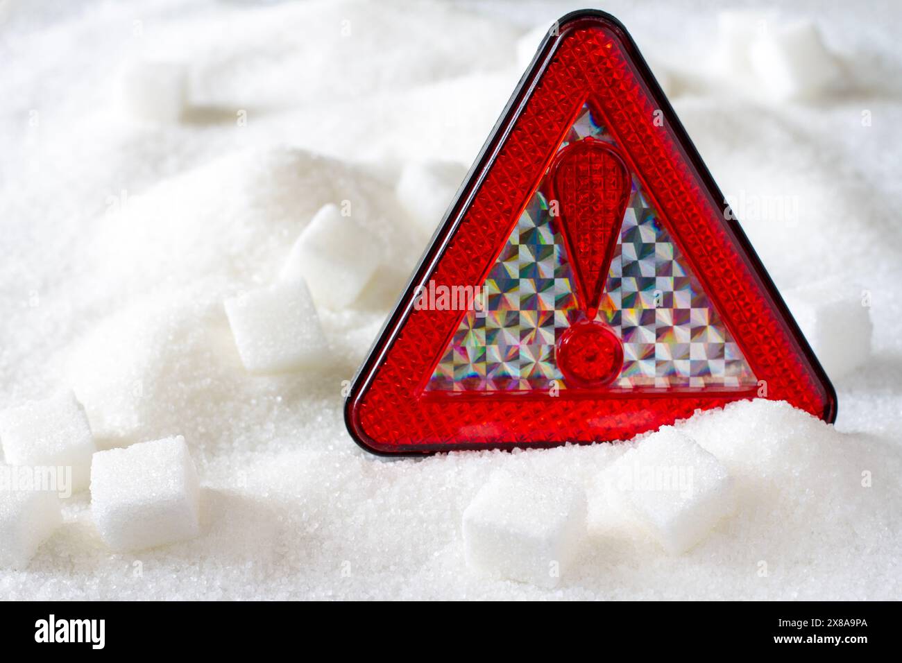 Warning sign in sugar, unhealthy white sugar concept Stock Photo - Alamy