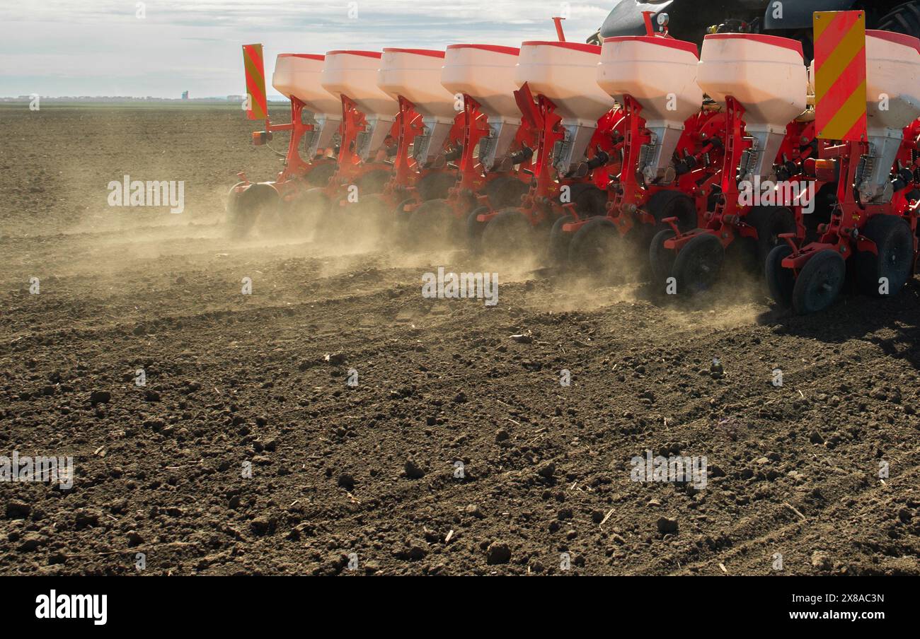 Agricultural machinery - Tractor and seeder for sowing corn Stock Photo ...