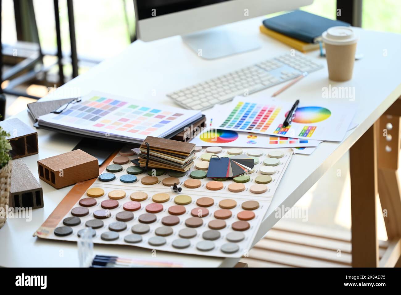 Interior designer working table with material sample and color swatches ...