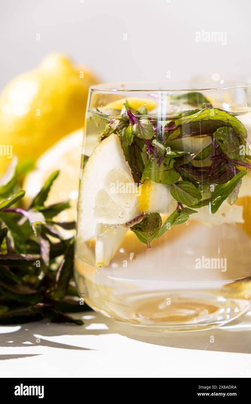 A glass of refreshing lemon water with mint Stock Photo - Alamy