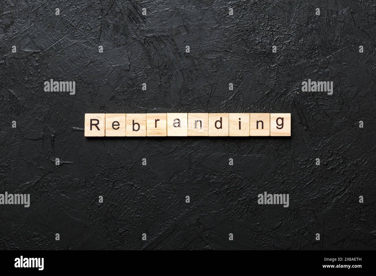 rebranding word written on wood block. rebranding text on table ...