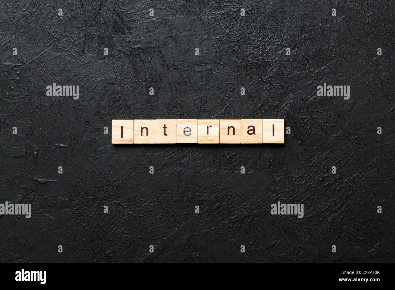 INTERNAL word written on wood block. INTERNAL text on cement table for ...