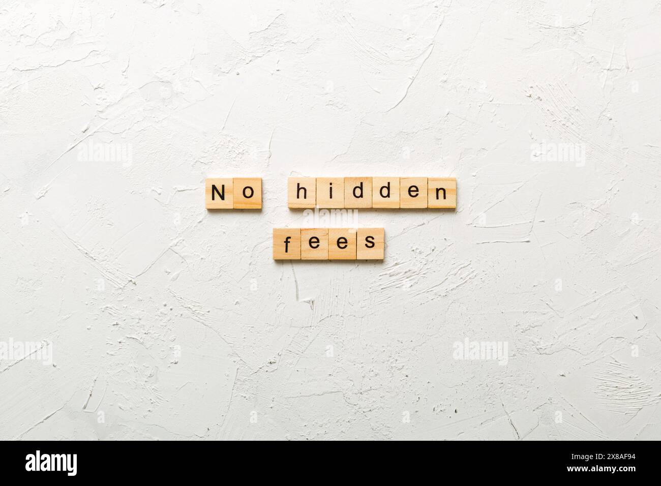 No hidden fees word written on wood block. No hidden fees text on ...