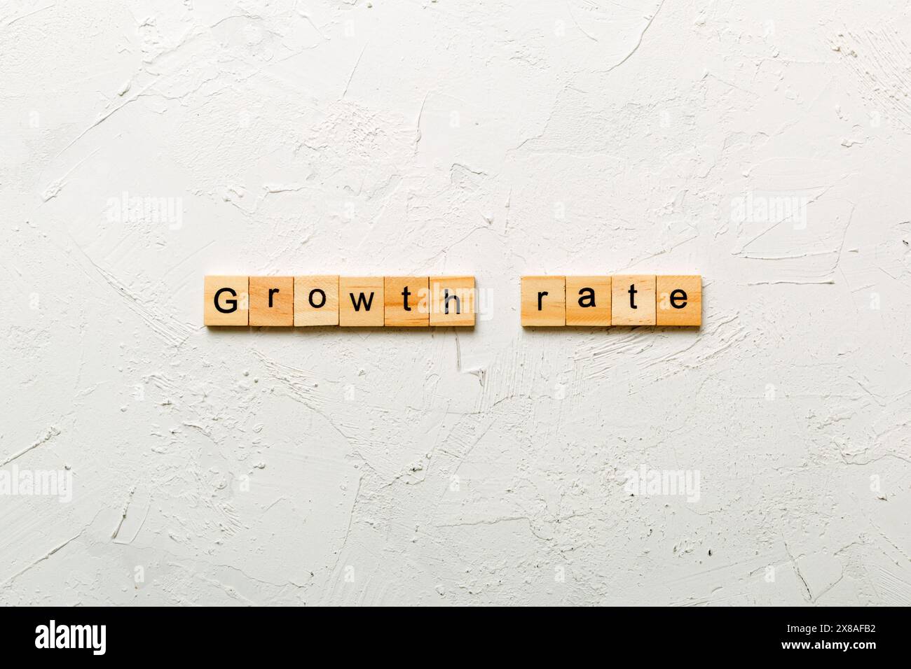 growth rate word written on wood block. growth rate text on cement ...