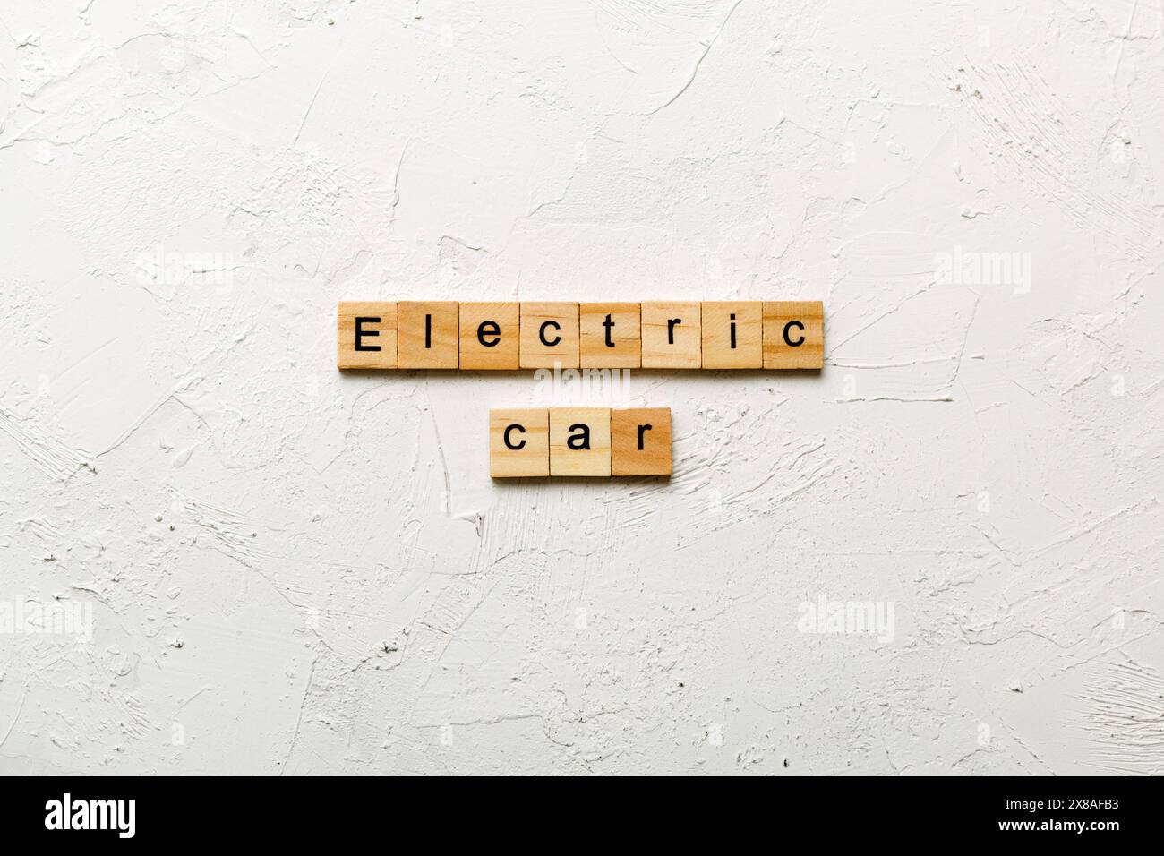 Electric Car word written on wood block. Electric Car text on cement ...