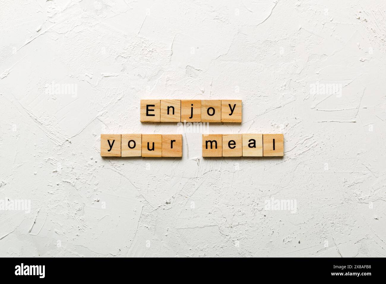 Enjoy your meal word written on wood block. Enjoy your meal text on ...