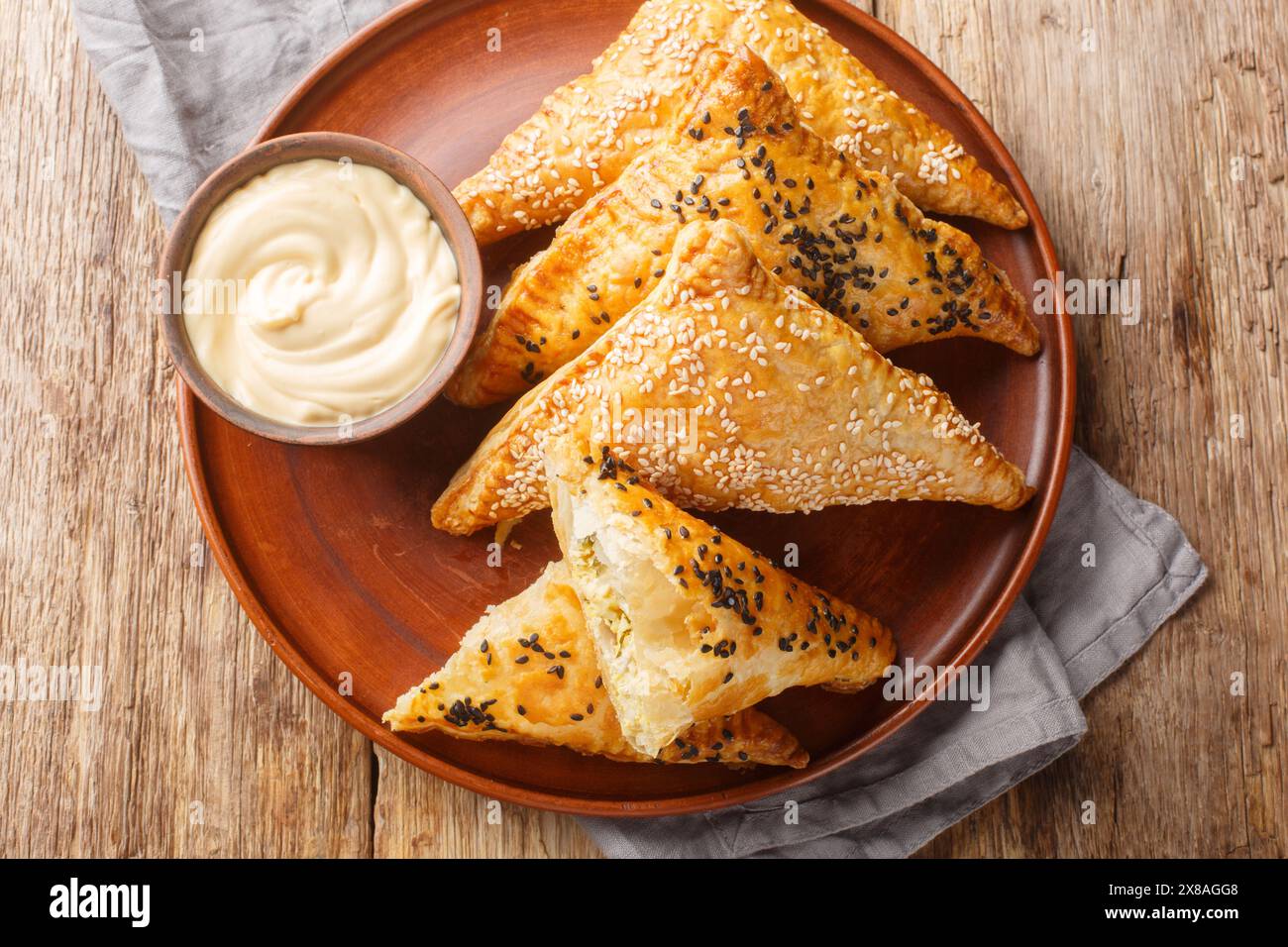 Chicken puff pastry pakistani patties served with sauce closeup on the ...