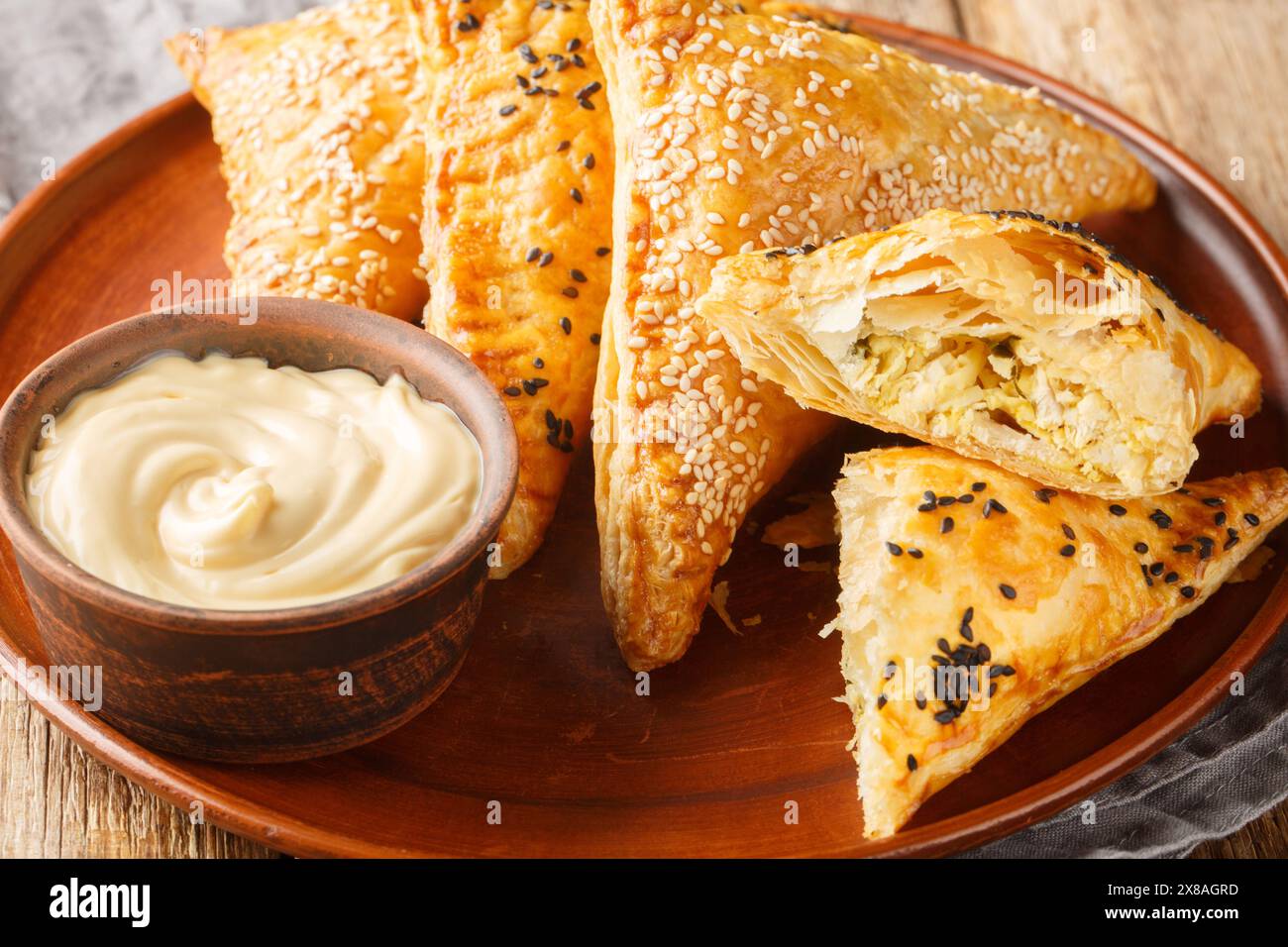 Chicken puff pastry pakistani patties served with sauce closeup on the ...