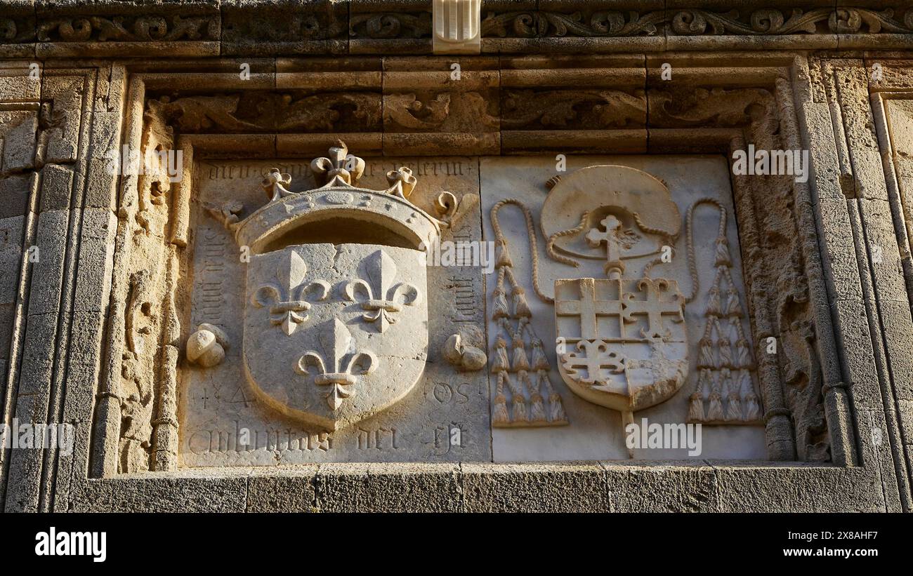 An elaborately designed stone relief with historical coats of arms and ...