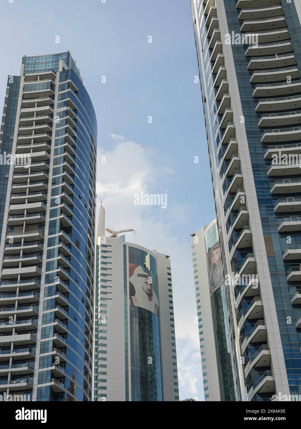 Ultra-modern buildings with glass facades under a cloudy sky, modern ...
