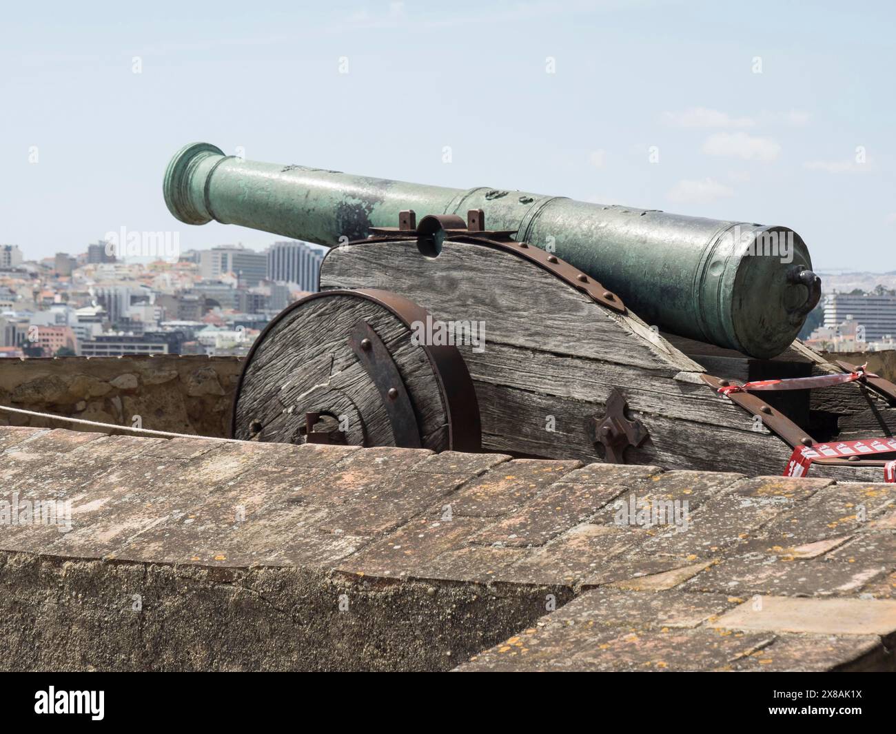 Old cannon on a fortress with a view of a city in the background, Old ...