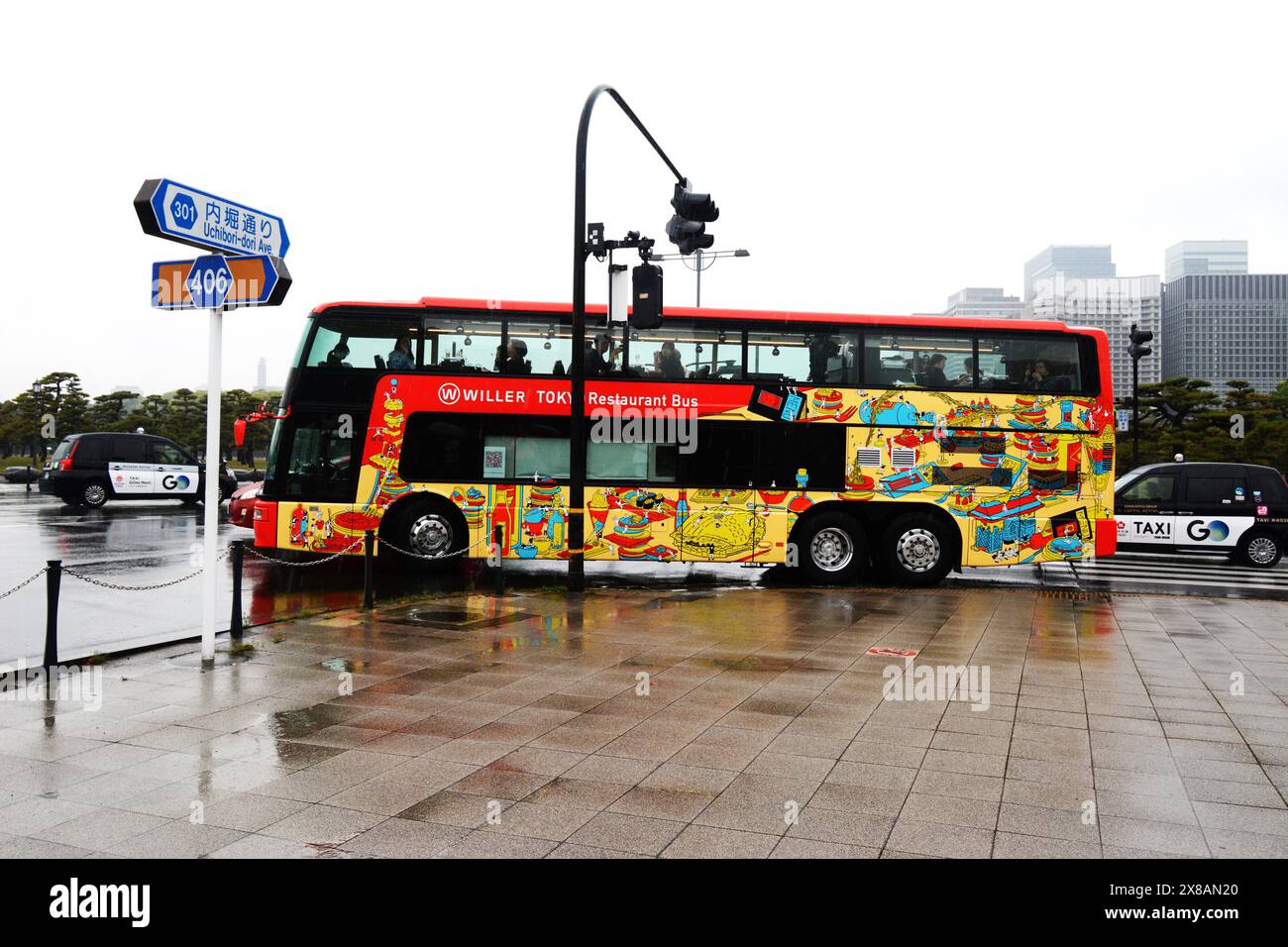 rain raining in Tokyo Japan umbrella umbrellas water street bus person ...