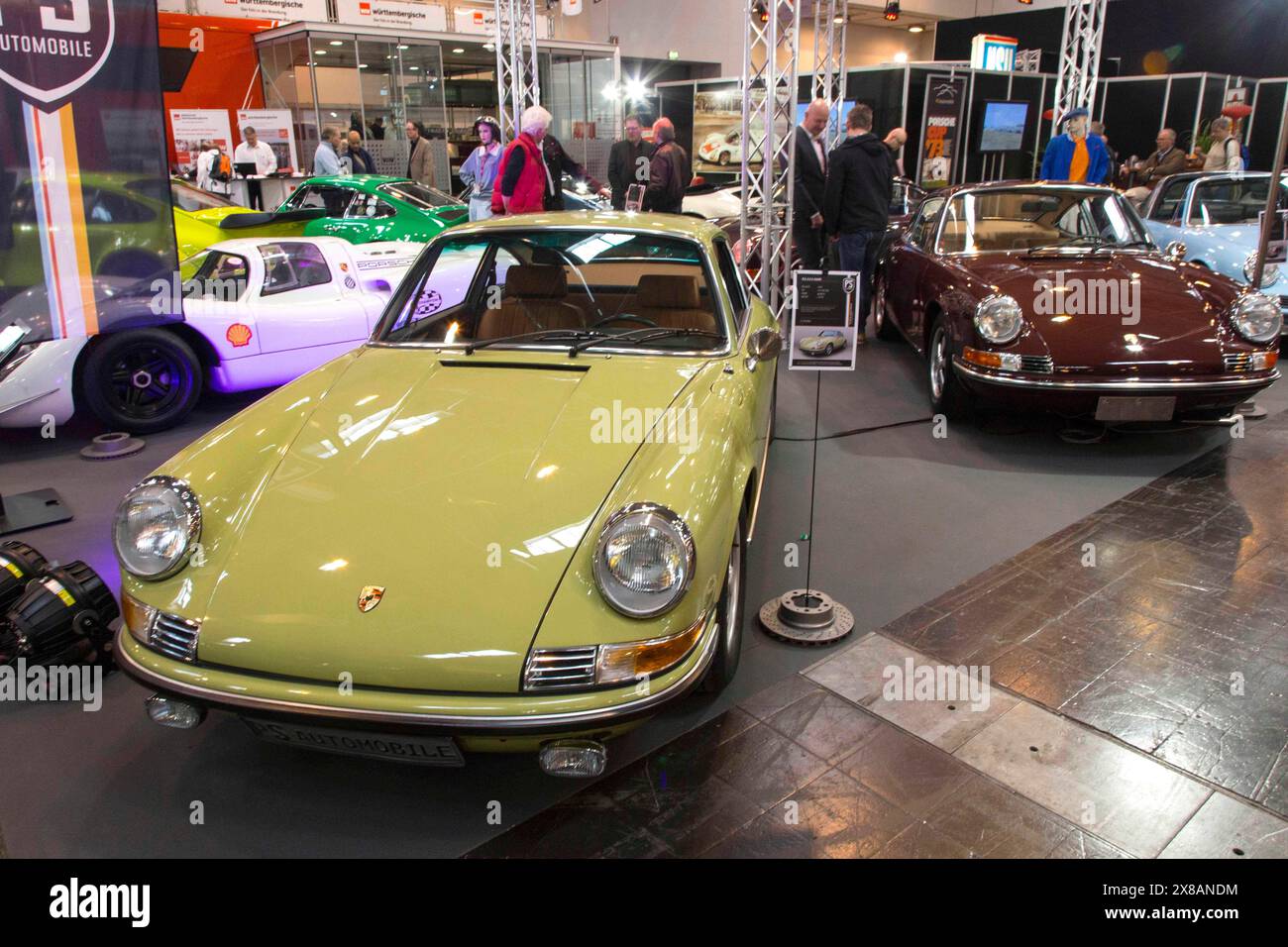 Visitors to Techno Classica take a look at Porsche 911 models. Techno ...