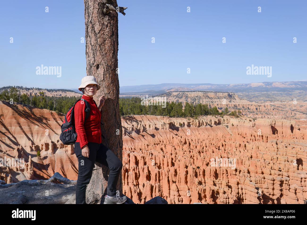 A female tourist posing for photos at Bryce Canyon Rim Trail. Utah. USA ...