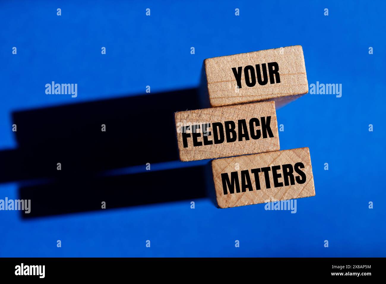 Your feedback matters words written on wooden blocks with blue ...