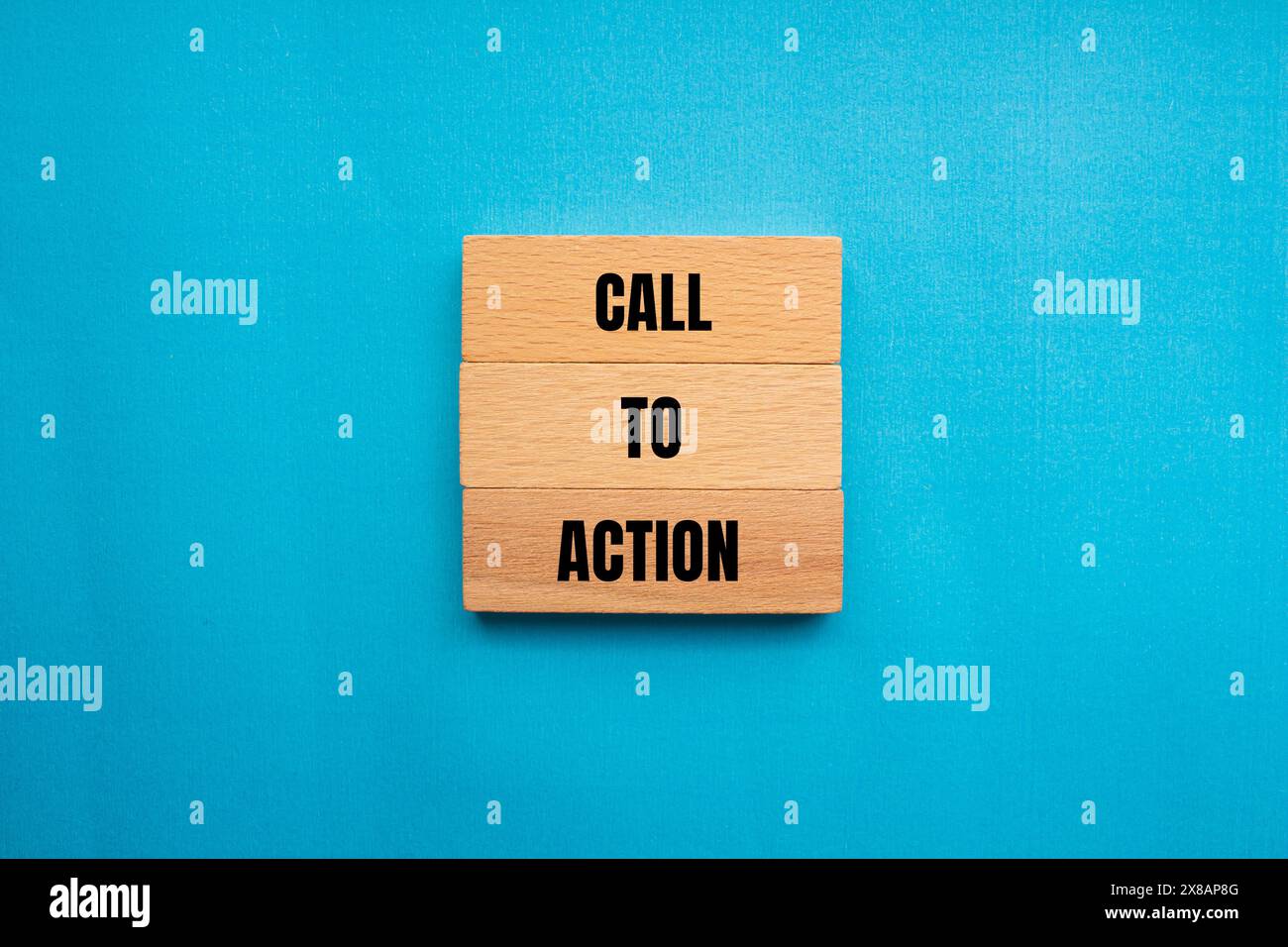 Call to action words written on wooden blocks with blue background ...