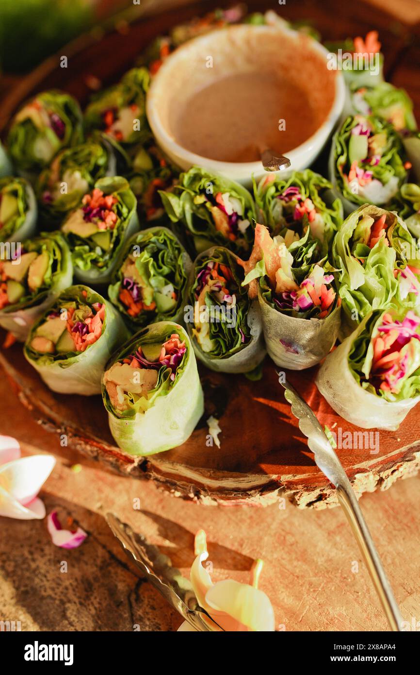 Spring Roll Display with peanut sauce at party Stock Photo - Alamy