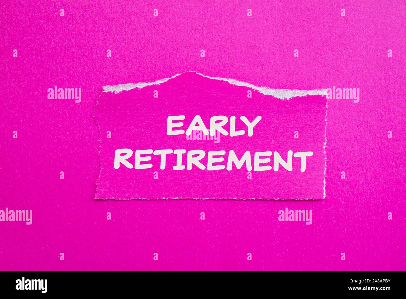 Early retirement words written on ripped paper with pink background ...