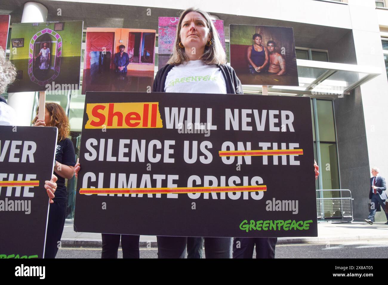 London, England, UK. 24th May, 2024. Greenpeace activists stand with ...