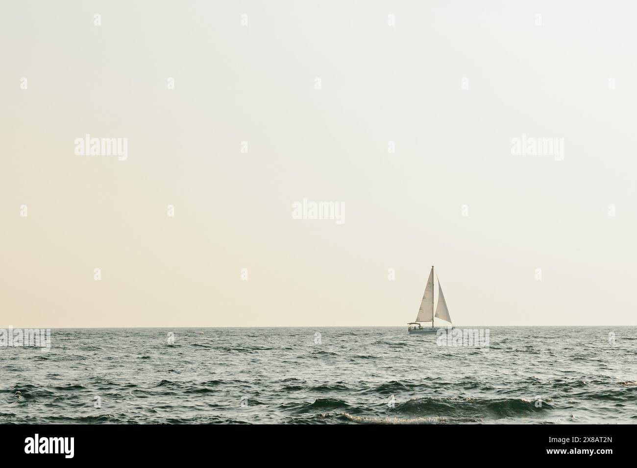 Sail boat floats in tropical paradise waves in Hawaii Stock Photo - Alamy