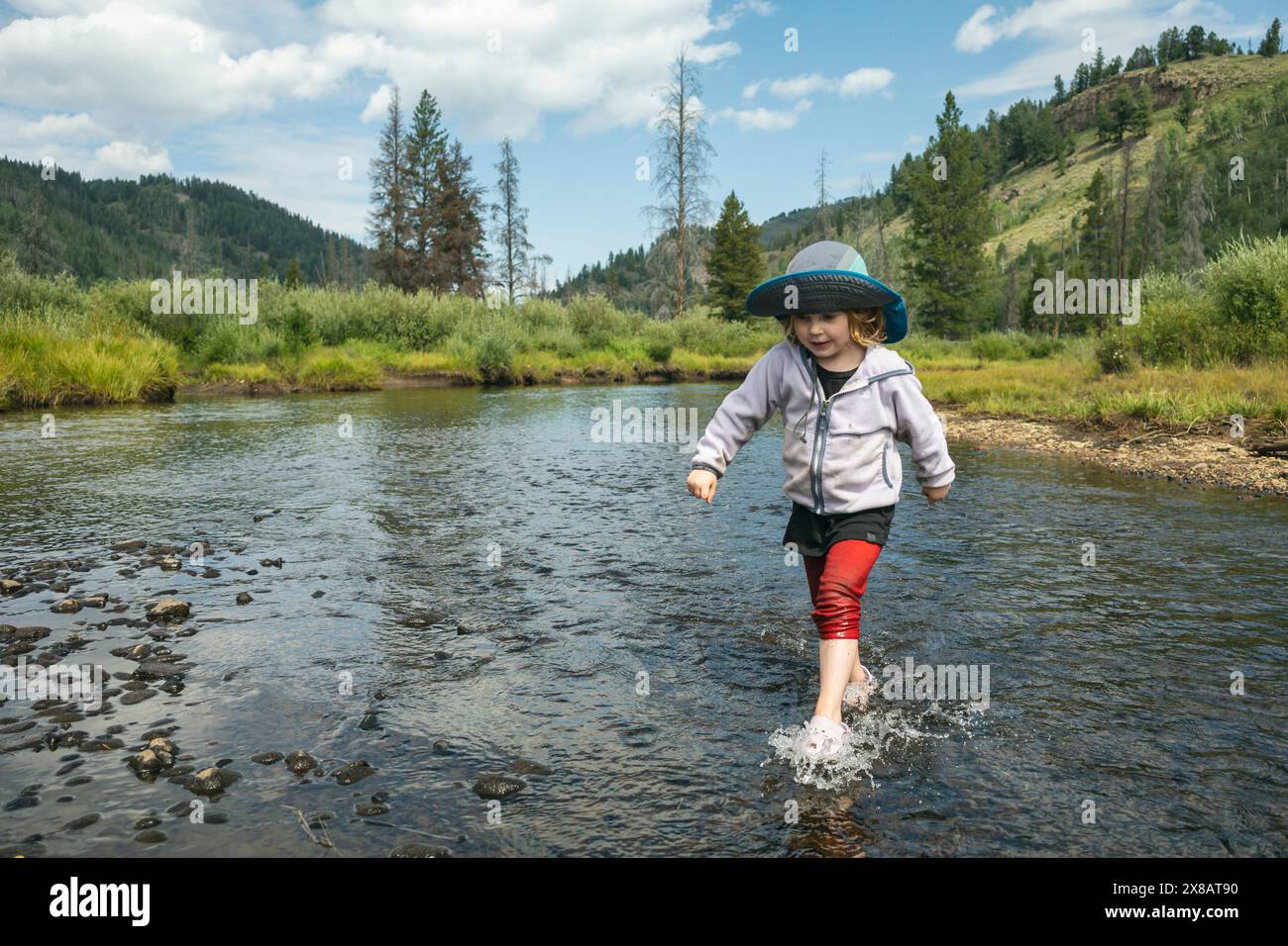 Child playing river summer hi-res stock photography and images - Alamy