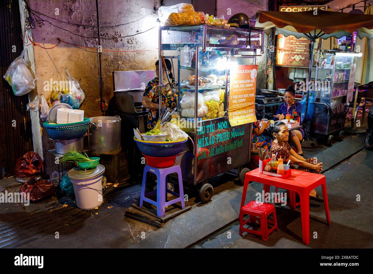 Street food restaurant in the streets of Saigon in Vietnam Stock Photo ...