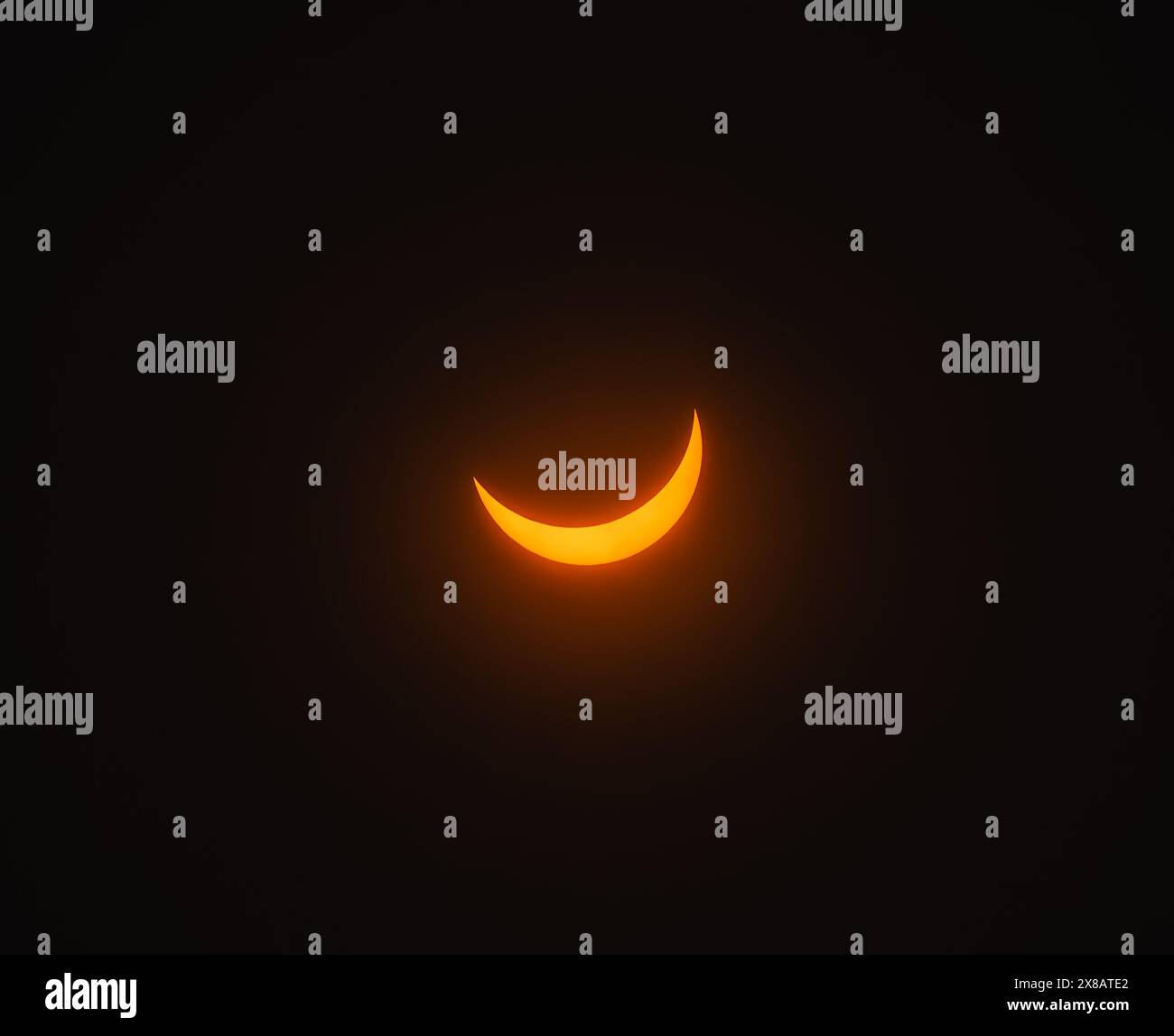 Phase of total solar eclipse where sun is partially blocked by moon ...