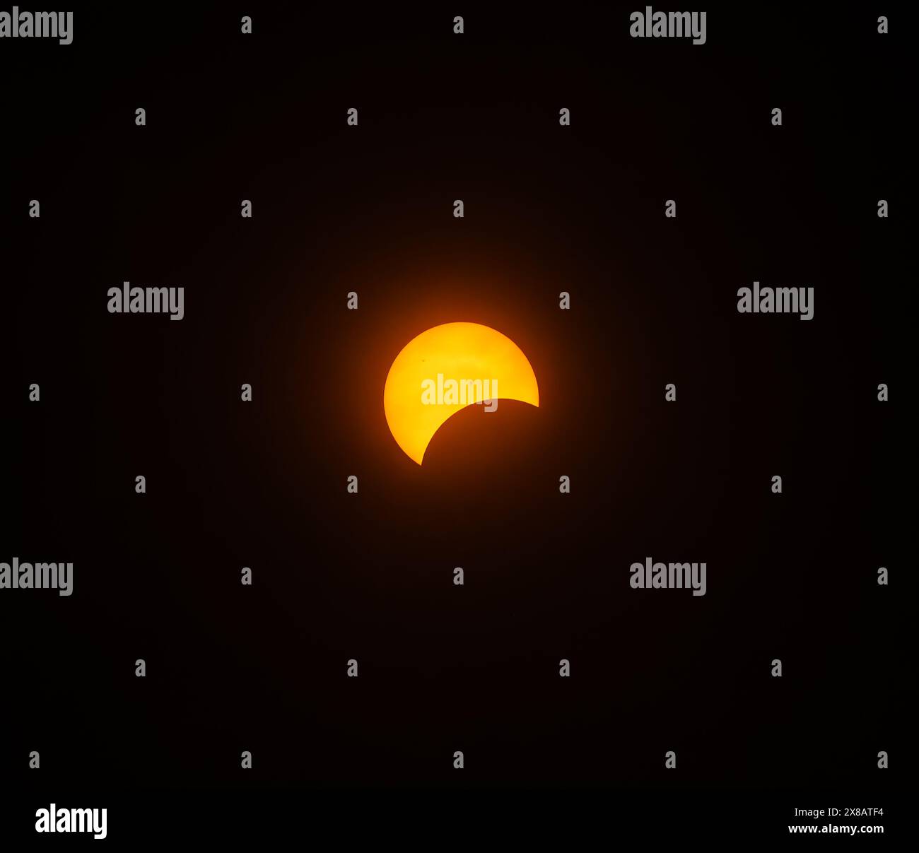Phase of total solar eclipse where sun is partially blocked by moon ...