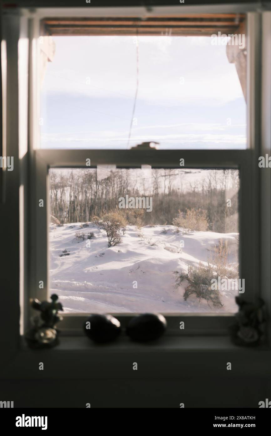 Serene winter landscape view from a cozy cabin window Stock Photo - Alamy