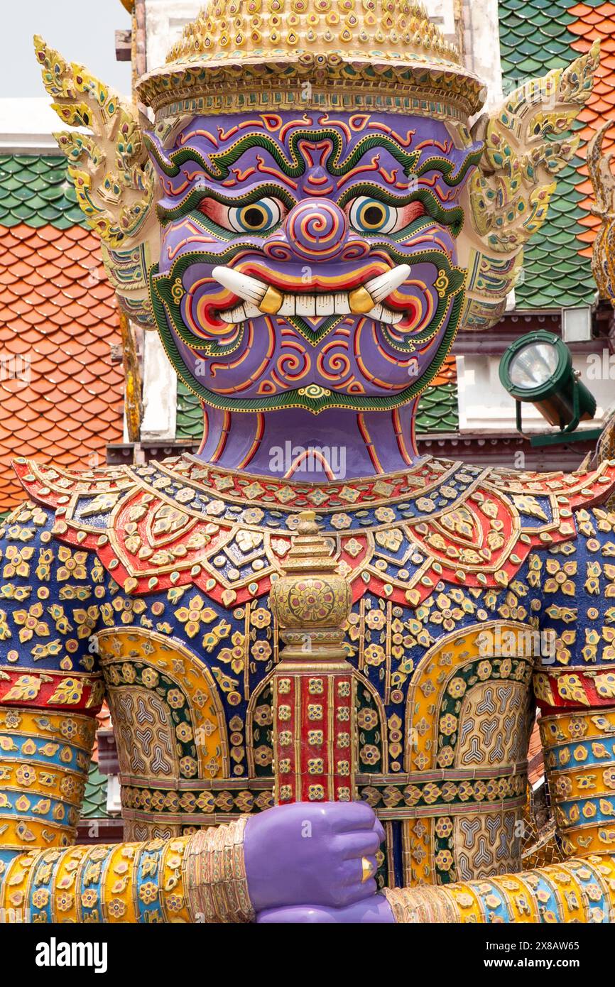 Giant statue of a guardian spirit, at a buddhist temple in Bangkok ...