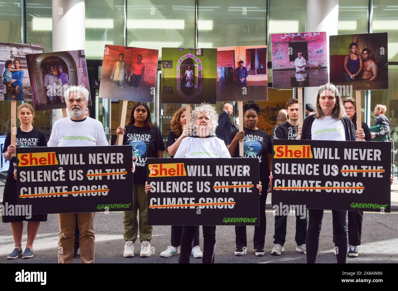 London, England, UK. 24th May, 2024. Greenpeace activists stand with ...