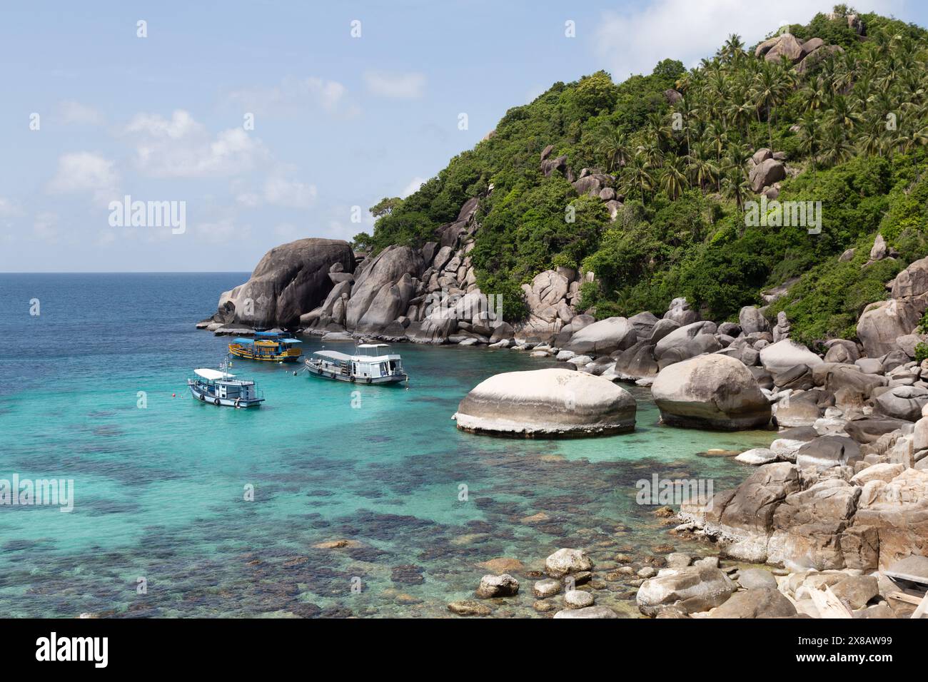 3 Diving boats, anchored at calm blue water bay in Thailand Stock Photo ...