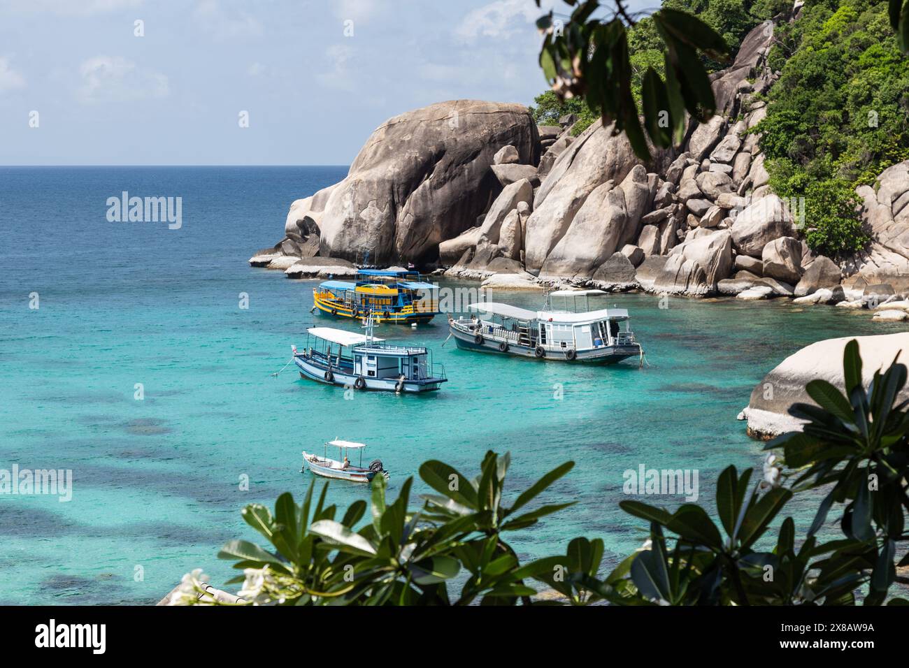 3 Diving boats, anchored at calm blue water bay in Thailand Stock Photo ...