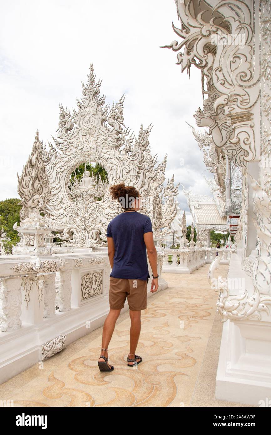 Male tourist walking around the White temple in Chiang Rai Stock Photo ...
