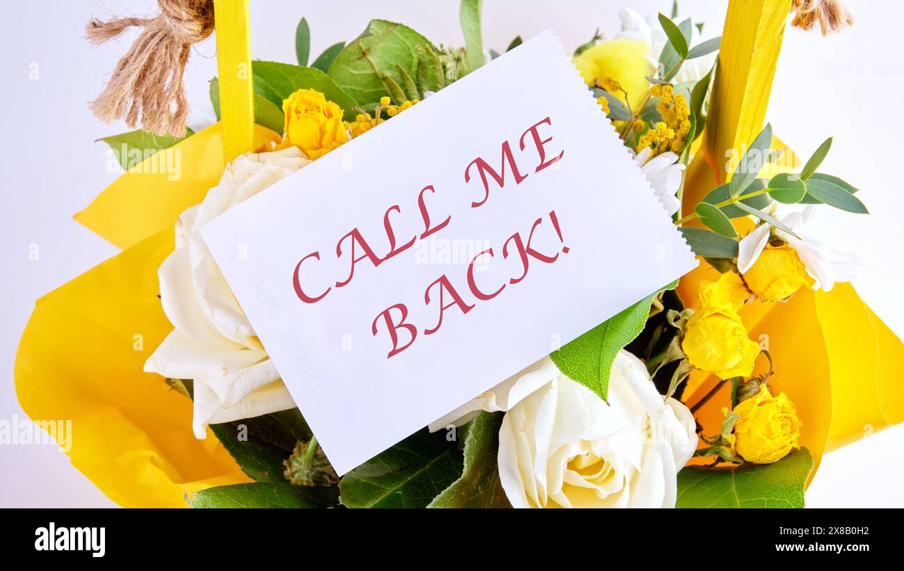 CALL ME BACK text written on a white blank sheet on flowers Stock Photo ...