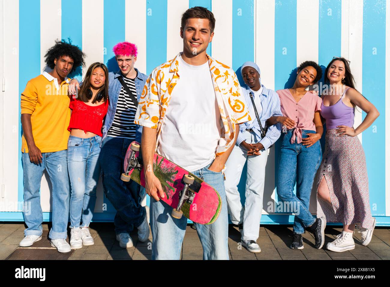 Multiethnic group of young happy friends hanging out in the city ...