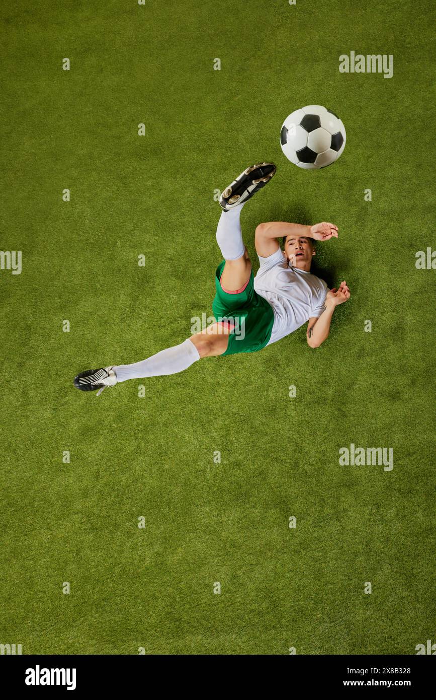 Dynamic top-down photo of footballer in green and white gear, captured ...