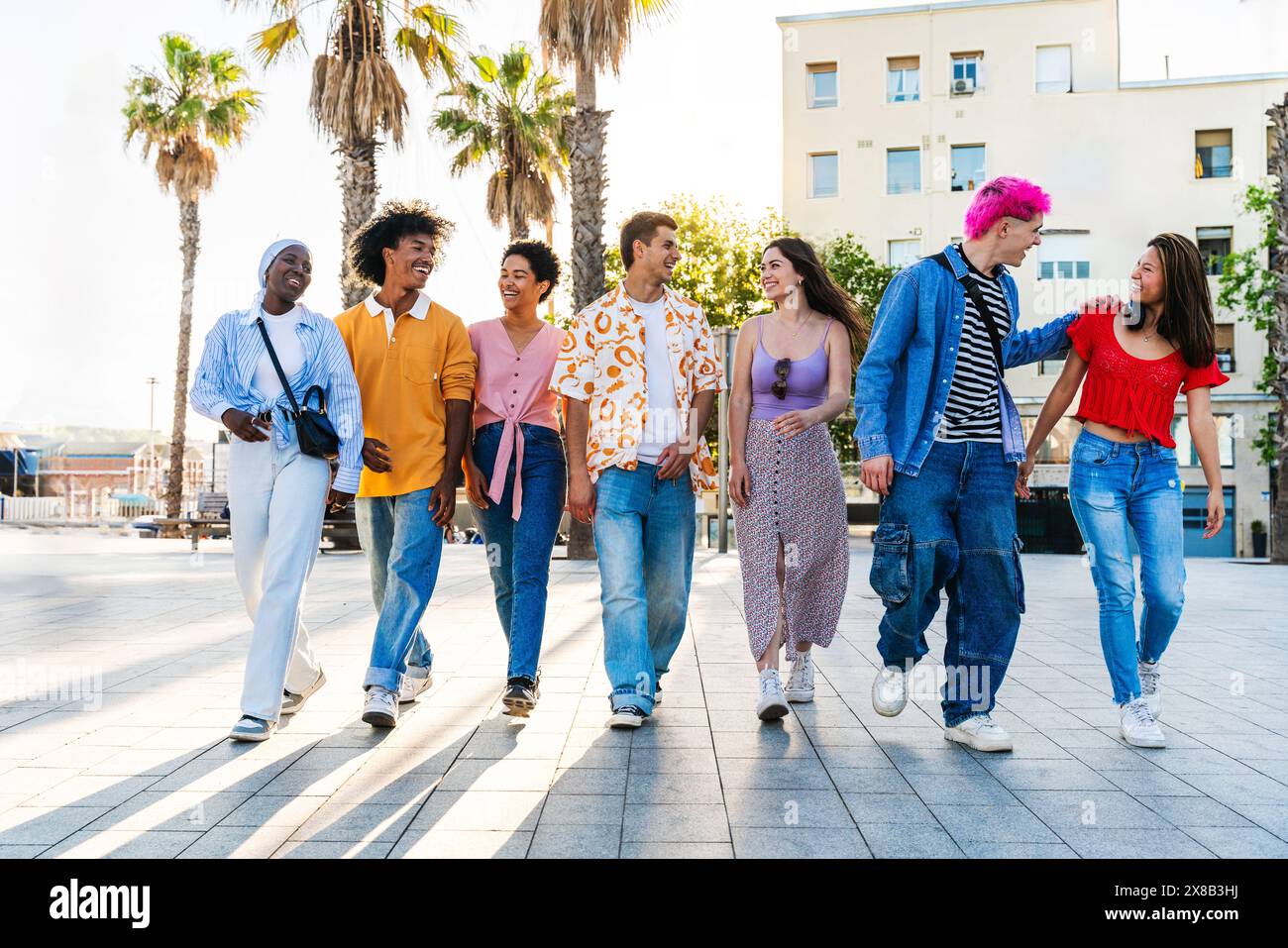 Multiethnic group of young happy friends hanging out in the city ...