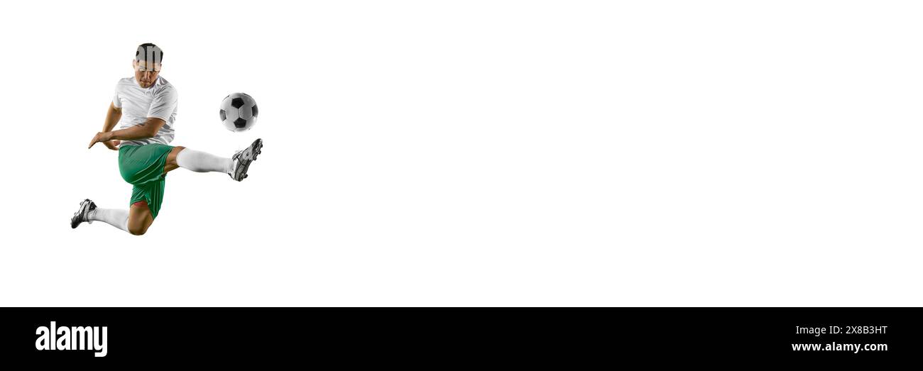 Banner. Professional sportsman, soccer player kicking ball against ...