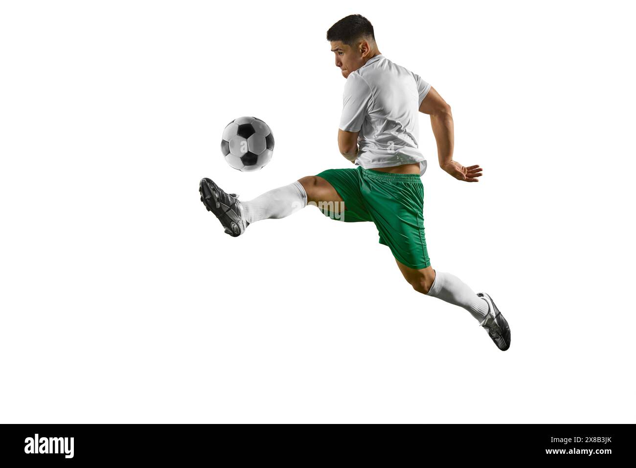 Dynamic portrait of young fit guy jumping to make perfect pas in motion ...