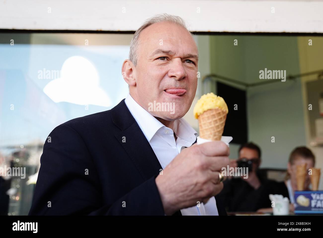 Liberal Democrat leader Sir Ed Davey eats ice cream on the promenade in ...