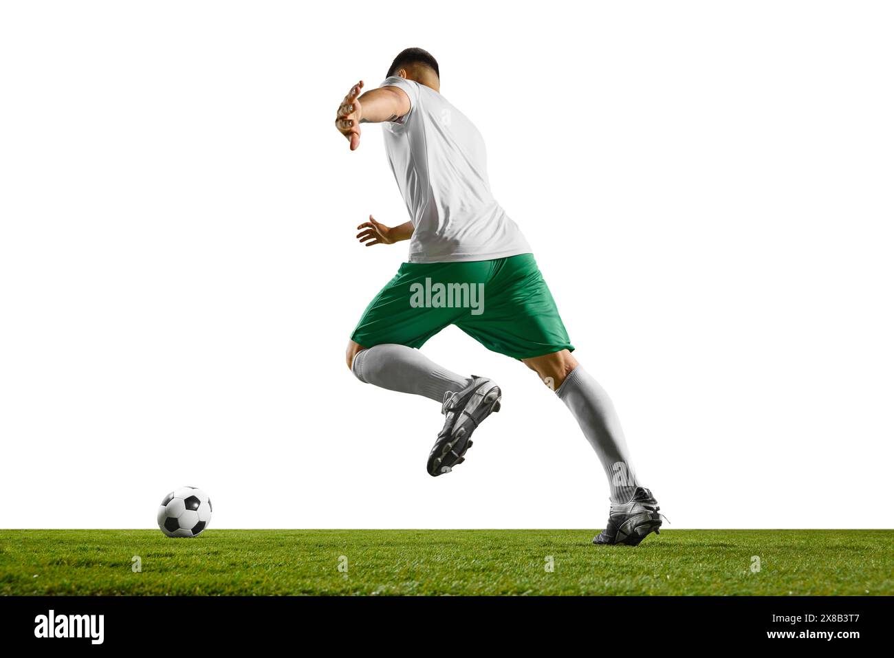 Rear view man kick ball hi-res stock photography and images - Alamy