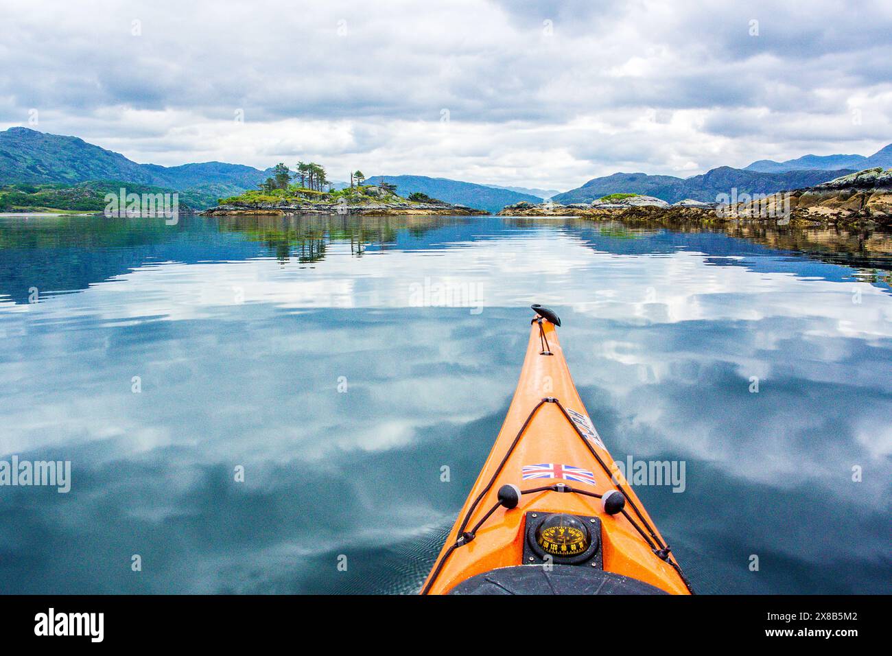 sea kayaking on Loch nan Uamh near Arisaig, on Scotland's west coast ...
