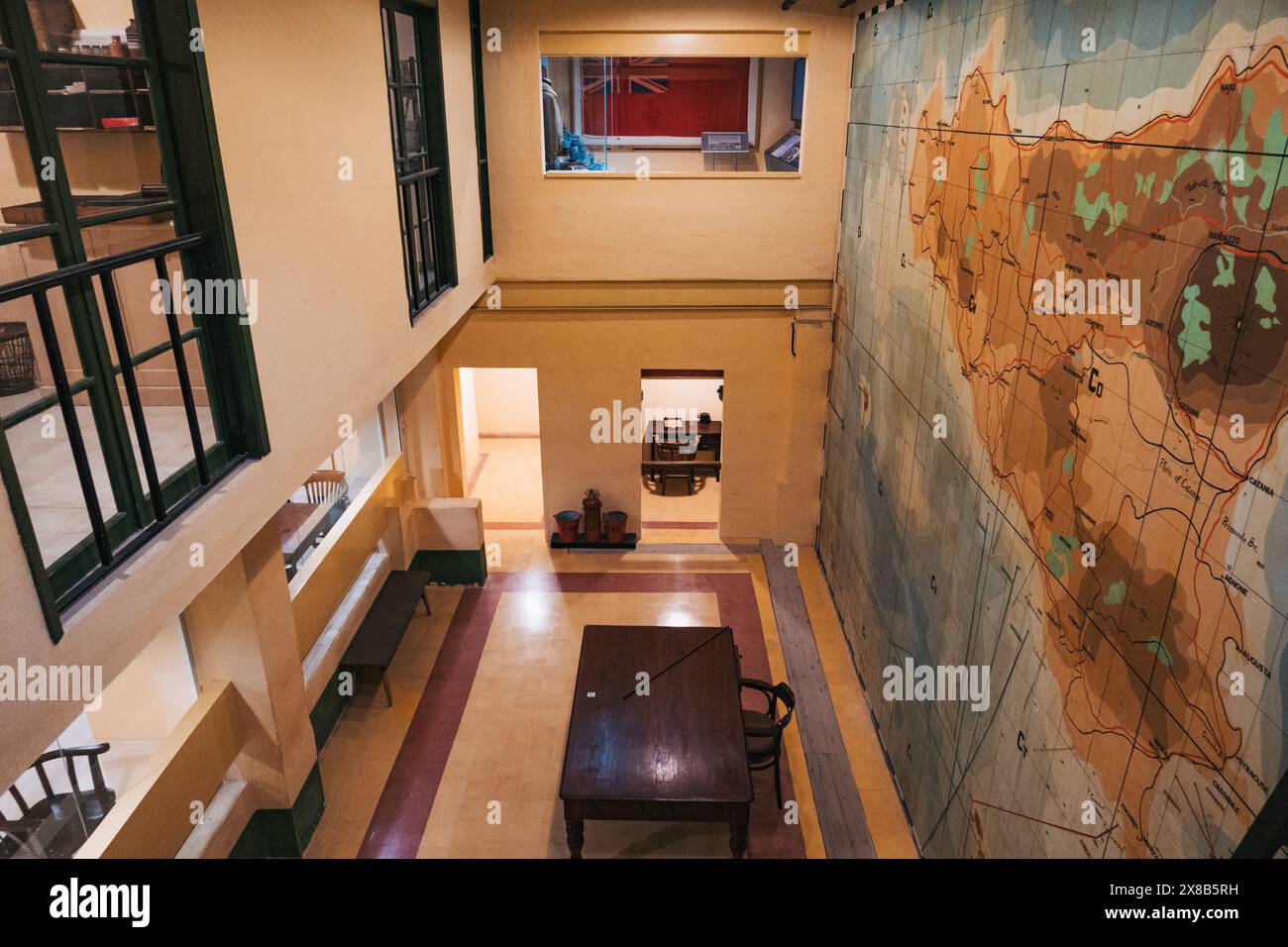 A room with a large map of Malta on the wall at the Lascaris War Rooms ...